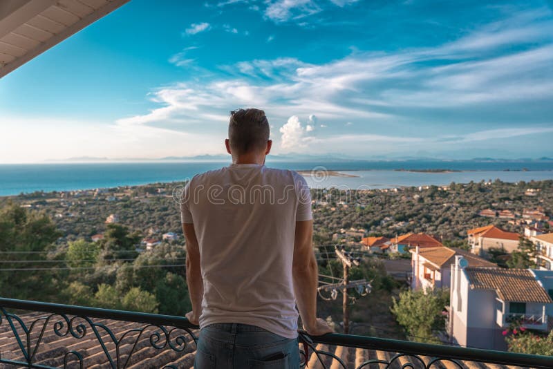 Man Enjoys Seaside Viewpoint from Balcony Stock Image - Image of marina ...
