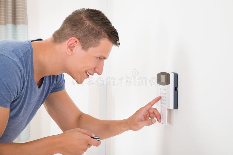 Man Entering Code in Door Security System Stock Image - Image of keypad ...