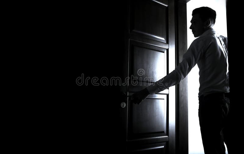 Man entering a dark room stock photo. Image of looking - 17799886
