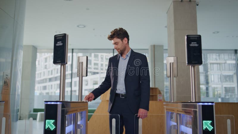 Confident Businessman Passing Electronic Gates with Face Recognition ...