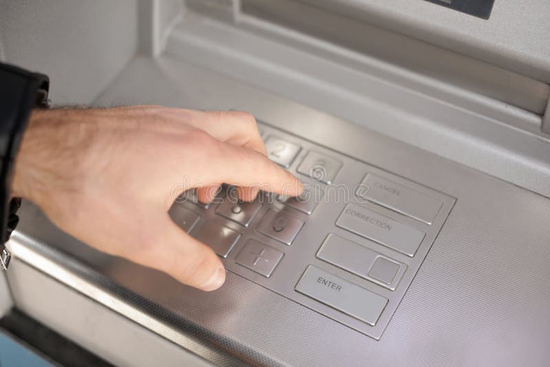 Man Entering PIN Code on Cash Machine Keypad Outdoors Stock Photo ...