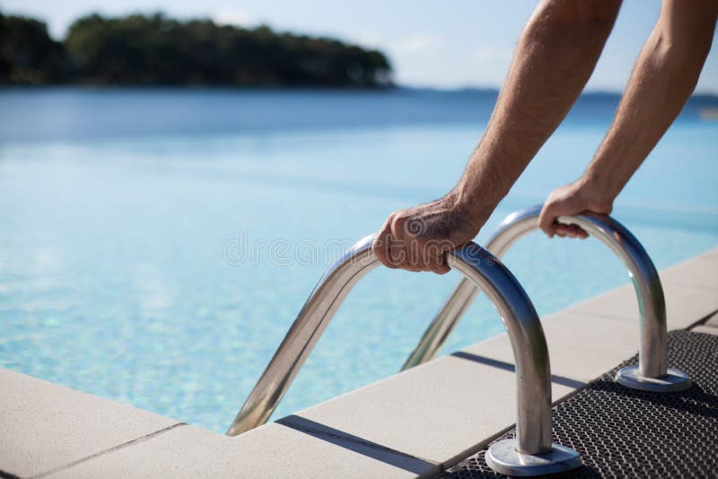 Man Entering Spa Pool stock photo. Image of bath, person - 20527328