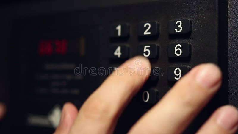 A Man Enters the Secret Code on a Safe Deposit Box Stock Footage ...