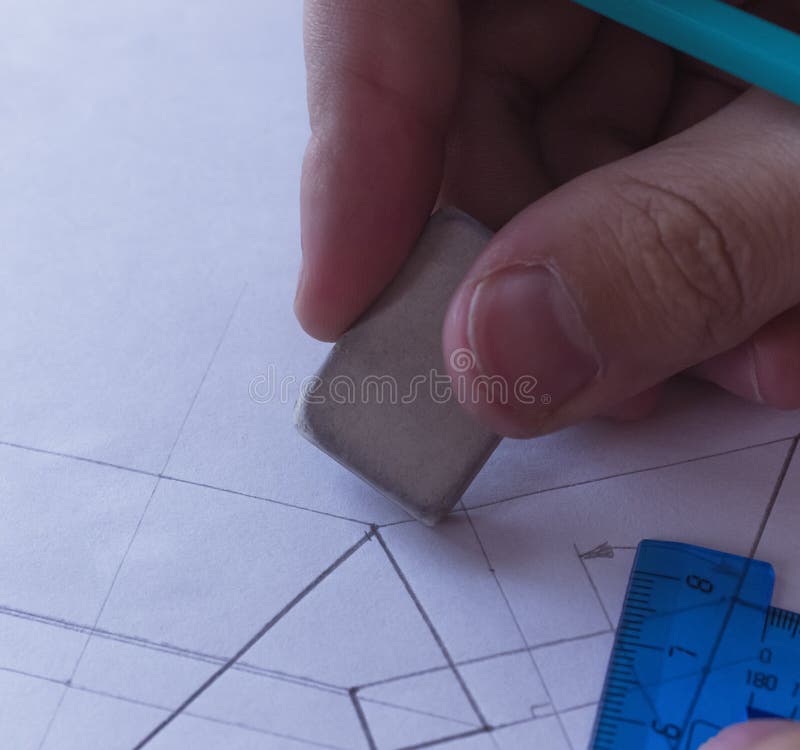 A Man Erases a Line from a Pencil on a World Map Stock Photo - Image of ...