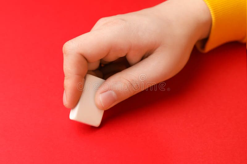 Man Erasing Something on Red Background, Closeup Stock Image - Image of ...