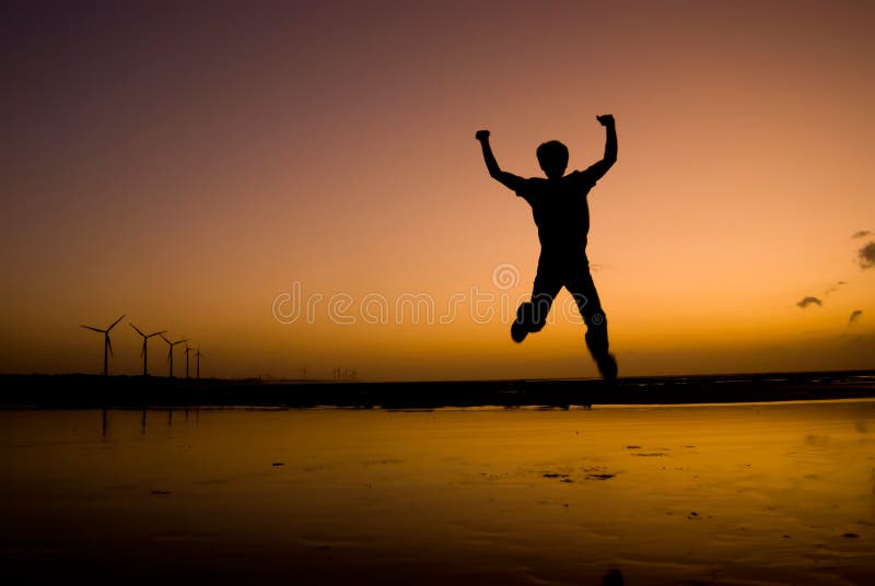 The Man Excited Jump on the Beach Under Sunset Stock Photo - Image of ...