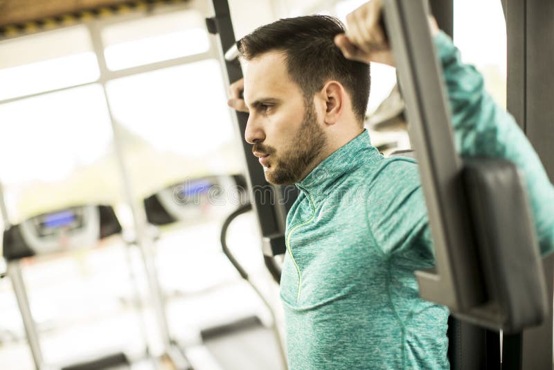 Man Exercise on an Exercise Machine at the Gym Stock Image - Image of ...