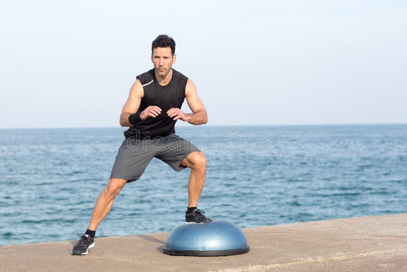 Man Exercising on Balance Platform Stock Photo - Image of strenghten ...