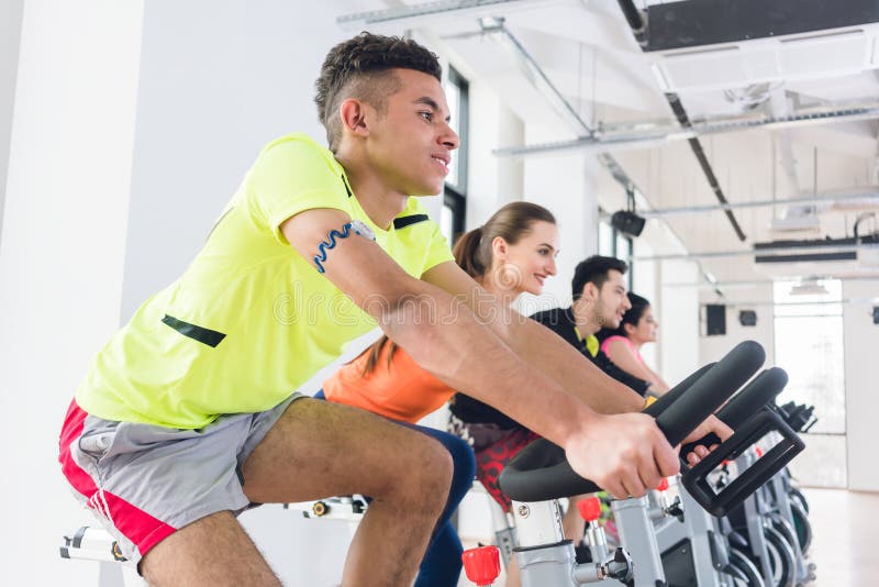Man exercising on bicycle stock photo. Image of adult - 153441914