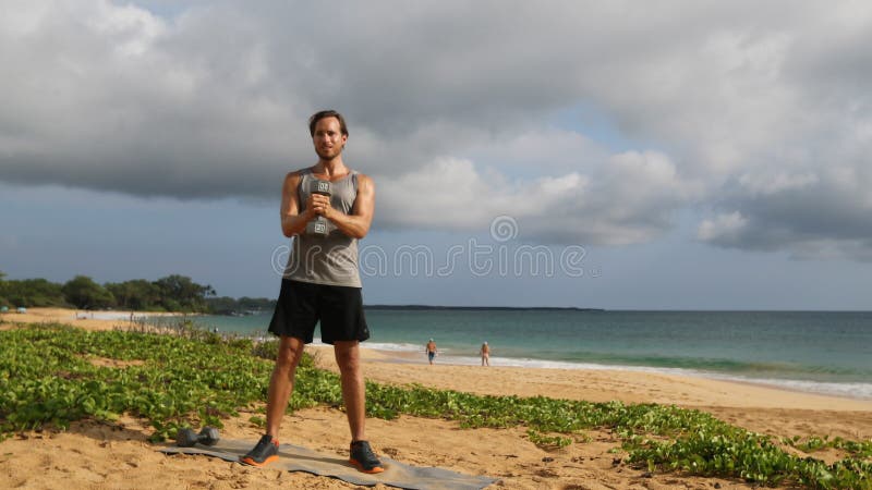 Man Exercising with Dumbbells Doing Standing Dumbbell Twist Workout ...