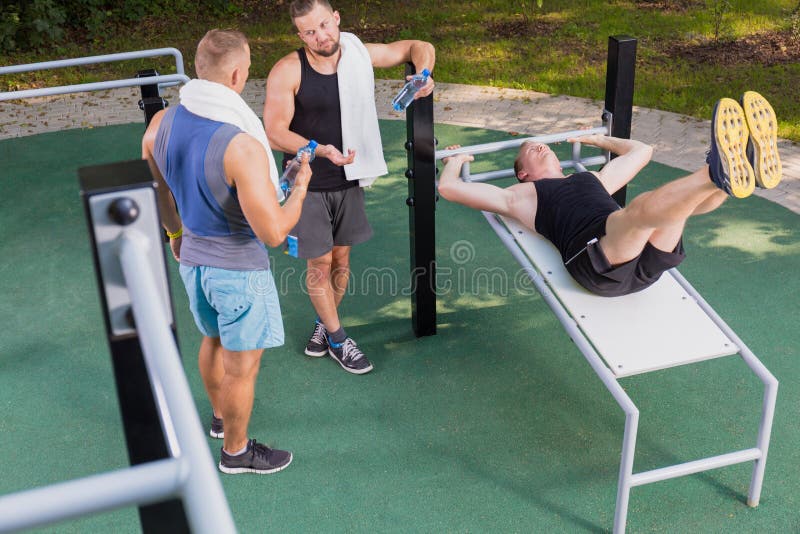 Man Exercising on Gym Table Stock Photo - Image of effort, strength ...