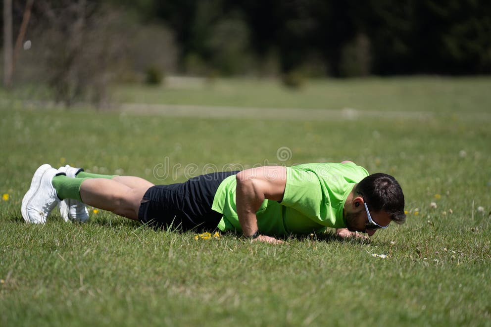 Man Exercising Outdoors Doing Advanced Push-Ups Stock Photo - Image of ...