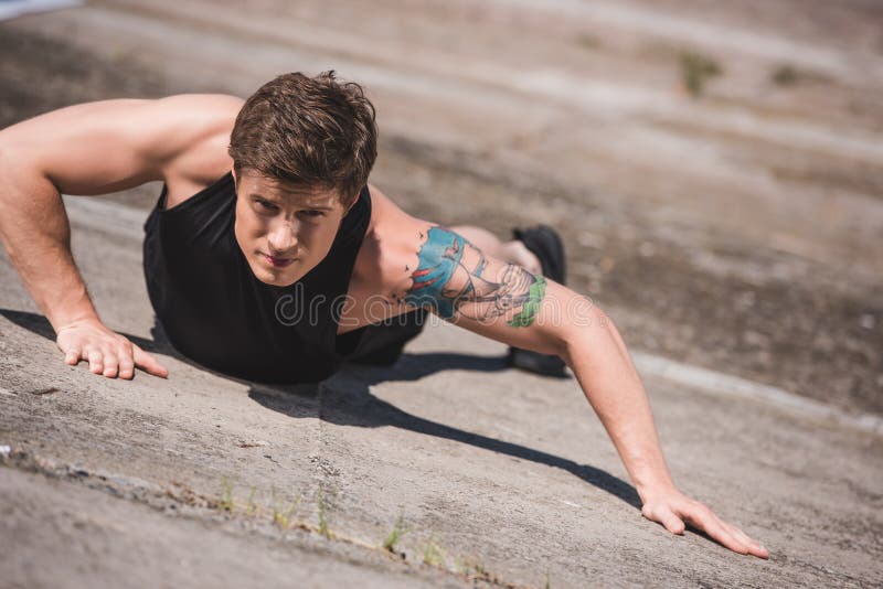 Man exercising on slabs stock image. Image of sport - 102010515