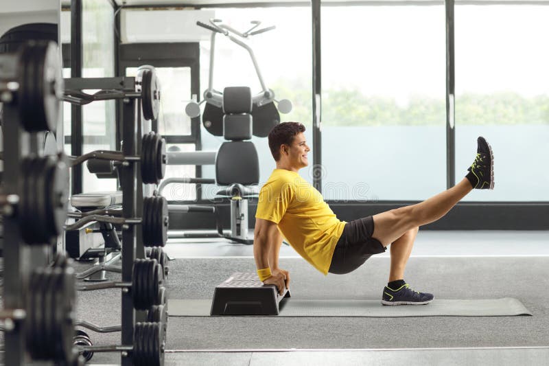 Man Exercising with a Step Aerobic Platform Stock Photo - Image of ...