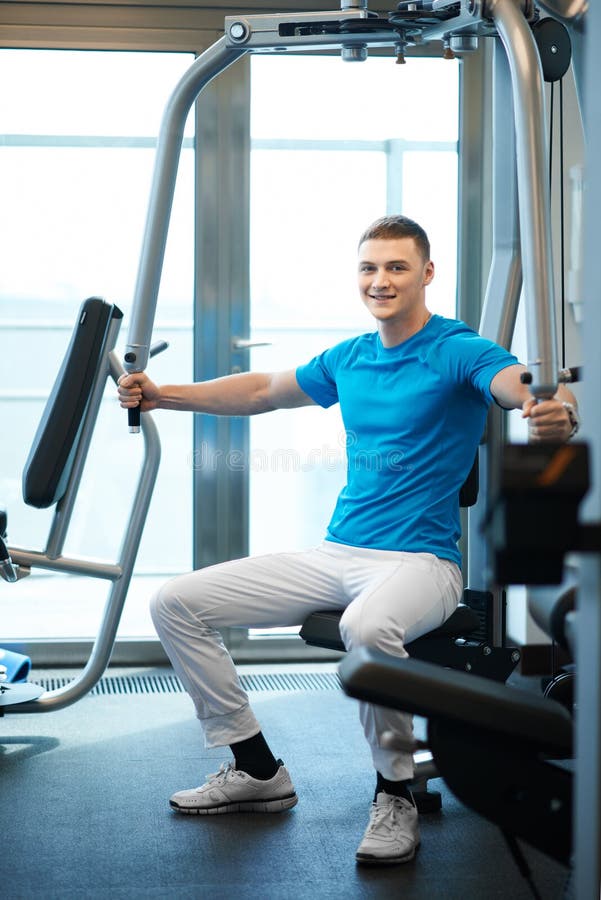 Man Exercising in Trainer for Pectoral Muscles Stock Photo - Image of ...