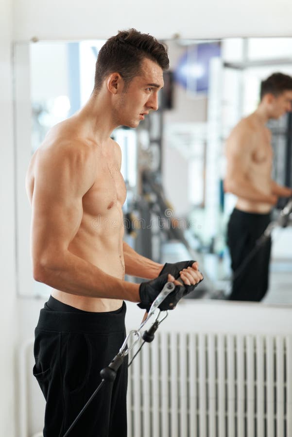 Man Exercising in Trainer for Triceps Muscles Stock Image - Image of ...