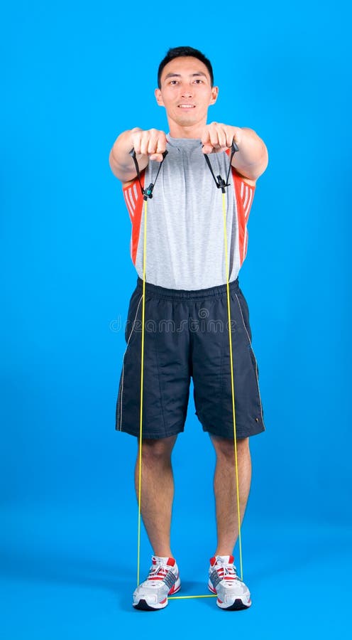 Man Using Elastic Exercise Tubing in Strengthening Stock Photo - Image ...