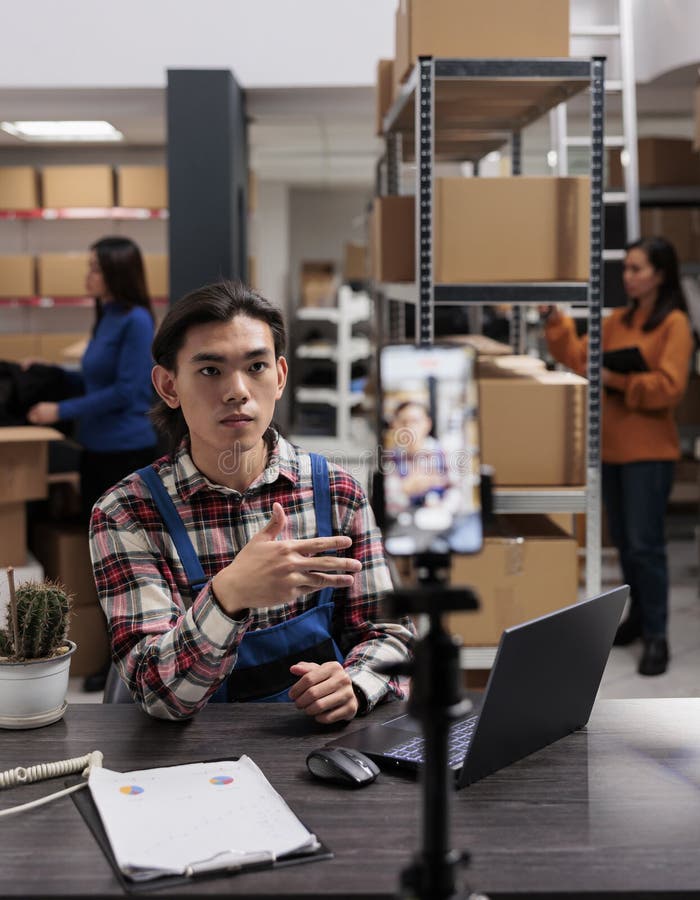 Man Explaining Parcel Shipping for Customer on Smartphone Camera Stock ...