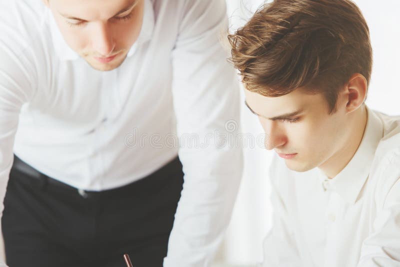 Man Explaining Something To Colleagues Stock Photo - Image of adult ...