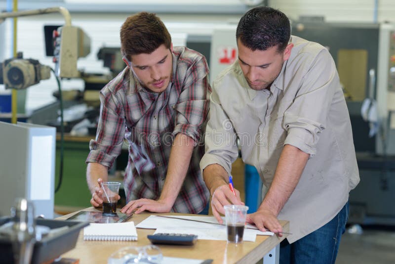 Man Explaining Working Machine To Trainee Stock Image - Image of ...