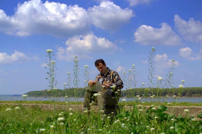 Man exploring a map stock photo. Image of bulgarian, camera - 68868110