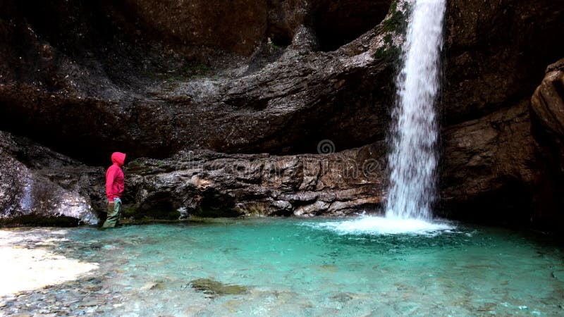 Man Exploring a Waterfall in the Dolomites Stock Video - Video of water ...