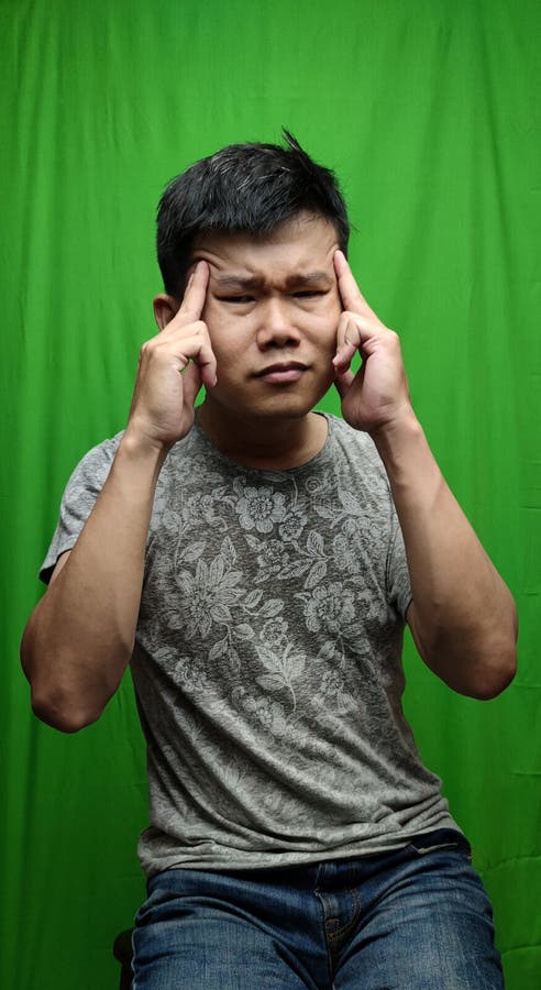 Discomfort with a Sickly Expression Stock Photo - Image of holding ...