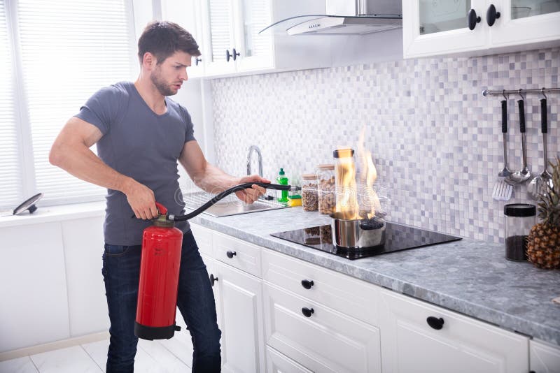 Man Extinguishing Burning Cooking Pot Stock Photo - Image of people ...