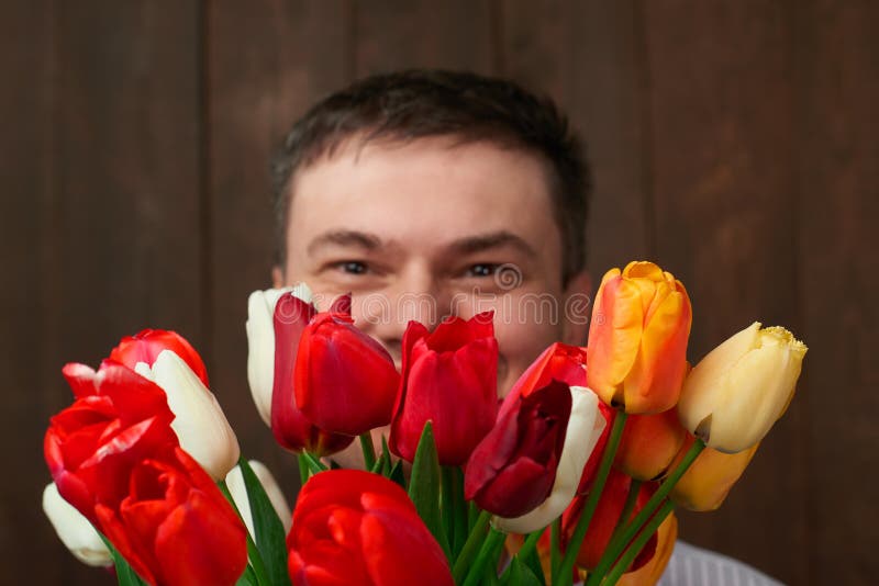 Man Face is Behind Tulip Flowers Stock Image - Image of bouquet, gift ...