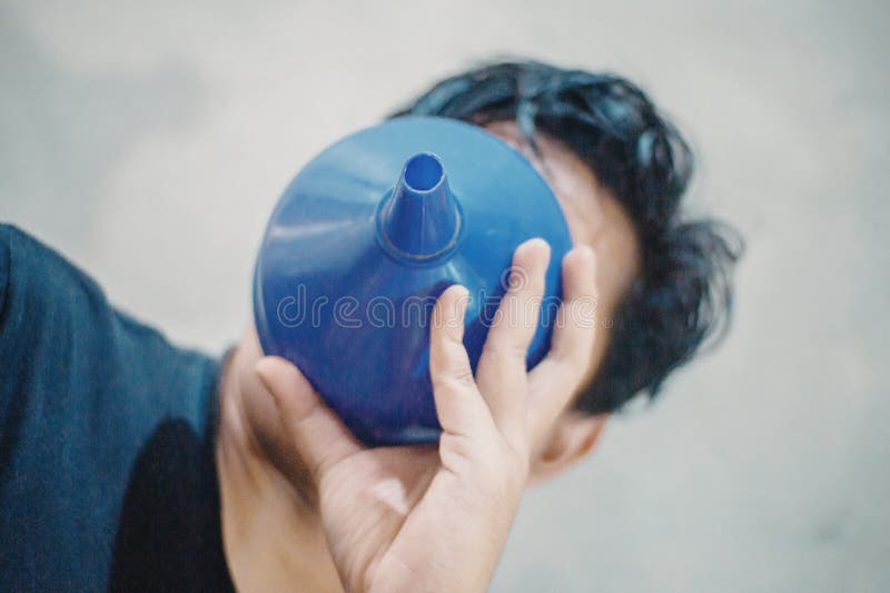 A Man with a Face Covered in a Blue Funnel Stock Image - Image of mouth ...