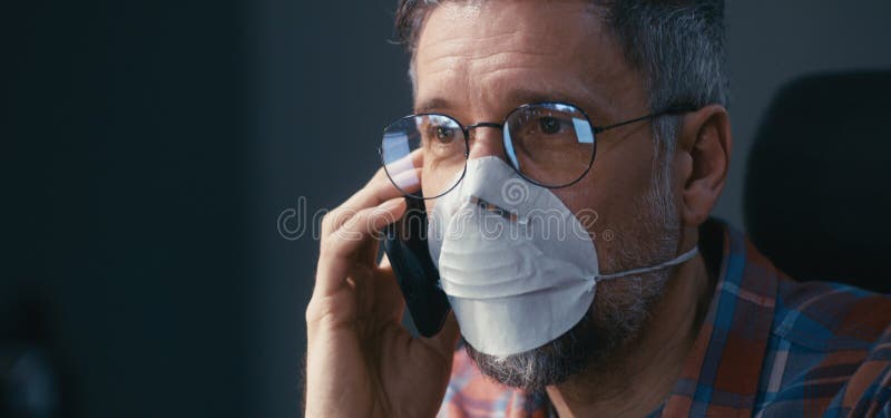 Man in Face Mask Having Phone Call Stock Photo - Image of smartphone ...