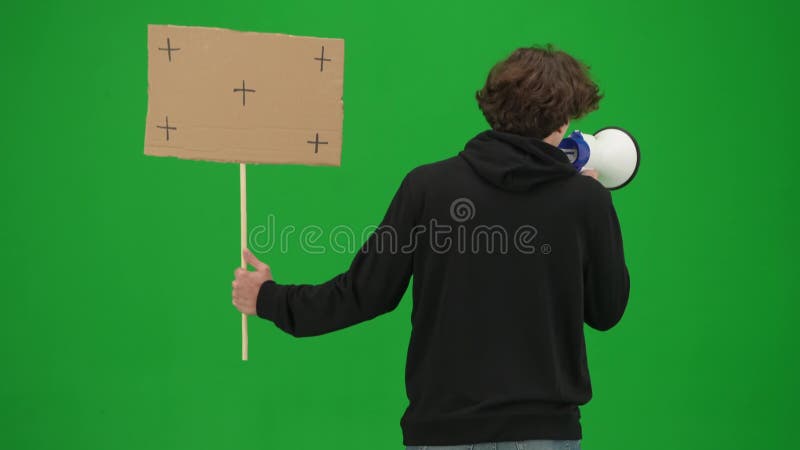 Man Facing Away from Camera Speaking into a Megaphone and Holds a Blank ...