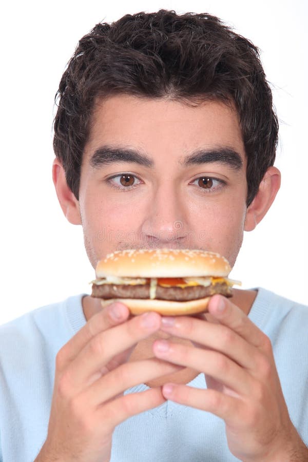 Man facing a hamburger stock image. Image of burger, junk - 33944853
