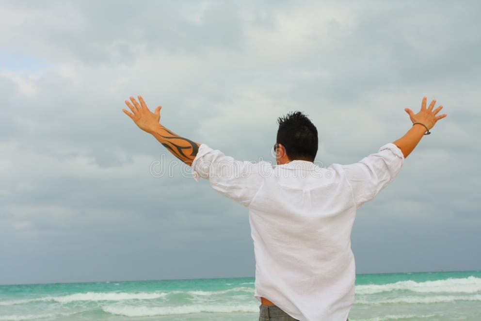 Man Facing the Ocean stock photo. Image of shirt, male - 4677322