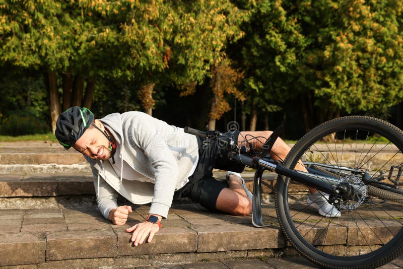 Man Fallen Off His Bicycle on Steps Outdoors Stock Photo - Image of ...