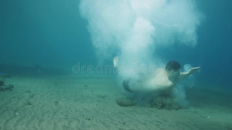 A Man Falls Down into Ocean Surface with Splash, View from Underwater ...