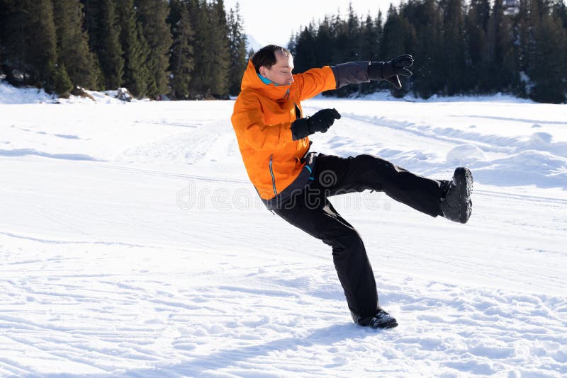 Man Falls on Slippery Road in Winter Stock Photo - Image of road, cold ...