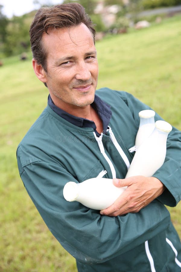 Man farmer with fresh milk stock image. Image of cattle - 64558429