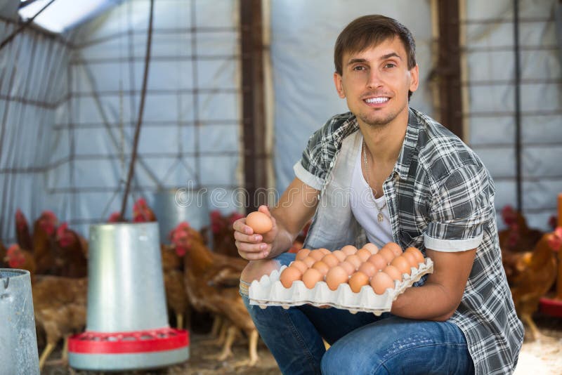 Man Farmer Holding Container with Fresh Eggs Stock Photo - Image of ...