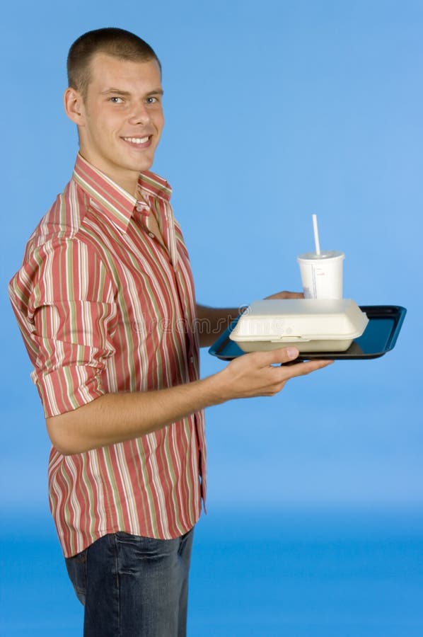 Man with fast food meal stock image. Image of bite, lunch - 1110825
