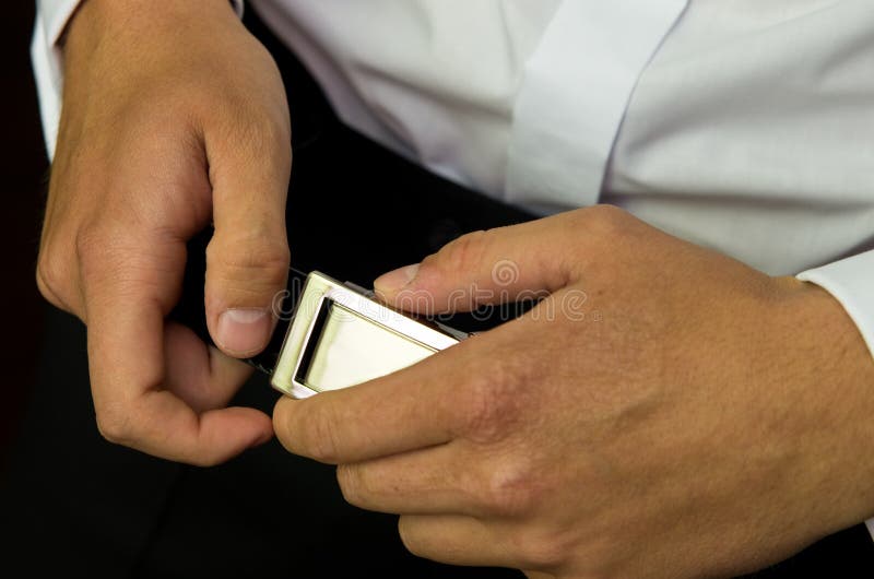 Man fastening belt stock photo. Image of dressed, black - 25280086