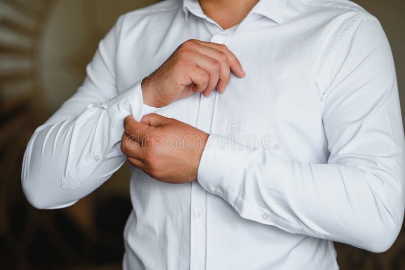 A Man Fastens Buttons on His Shirt. Stock Image - Image of gentleman ...