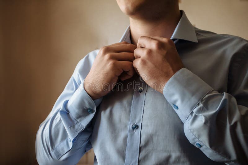A Man Fastens Buttons on His Shirt Stock Photo - Image of businessman ...