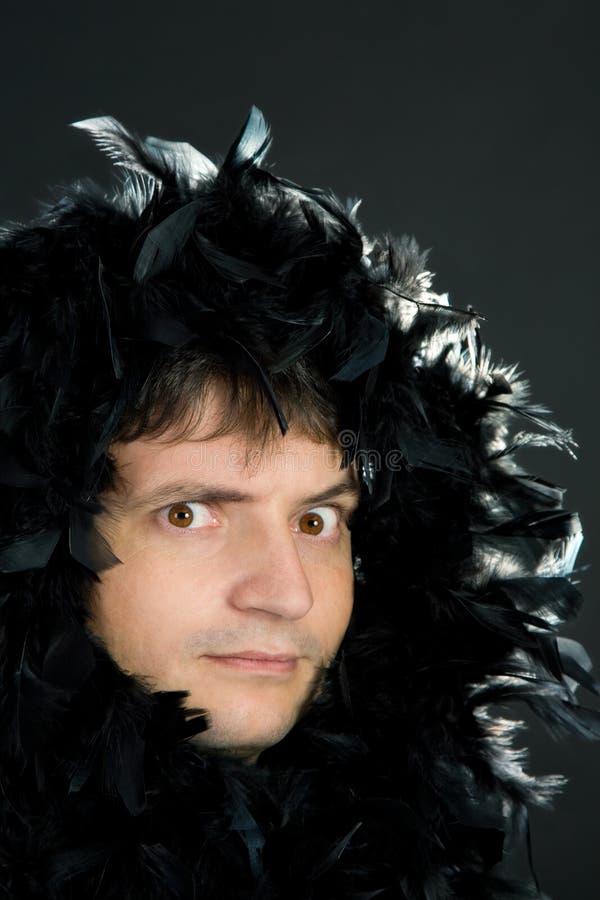 Man in feather boa stock image. Image of dark, dress - 11846155