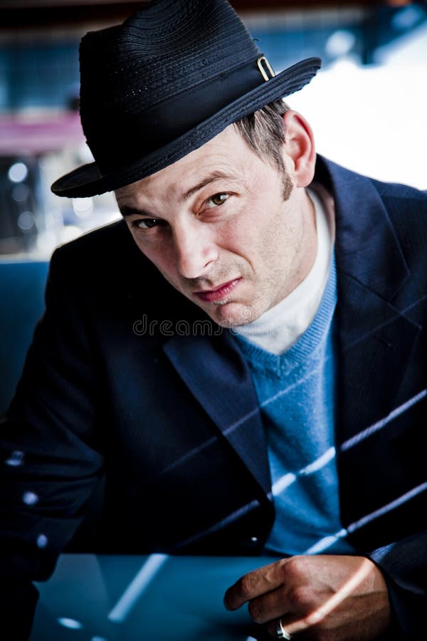 Man in Fedora Sitting at Diner Counter Stock Photo - Image of attitude ...