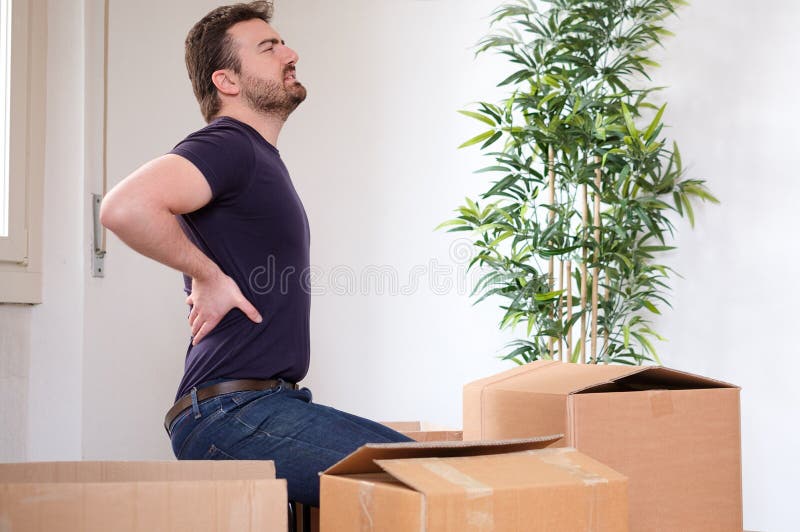 Man Feeling Back Ache Cramp Moving Heavy Boxes Stock Image - Image of ...