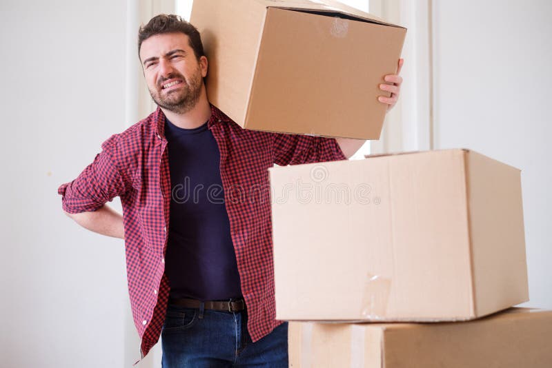 Man Feeling Back Ache Cramp Moving Heavy Boxes Stock Image - Image of ...