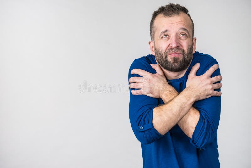 Man feeling cold gesturing stock photo. Image of home - 142885982