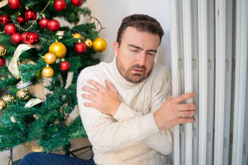 Man Feeling Cold at Home with Home Heating Trouble during Christmas ...