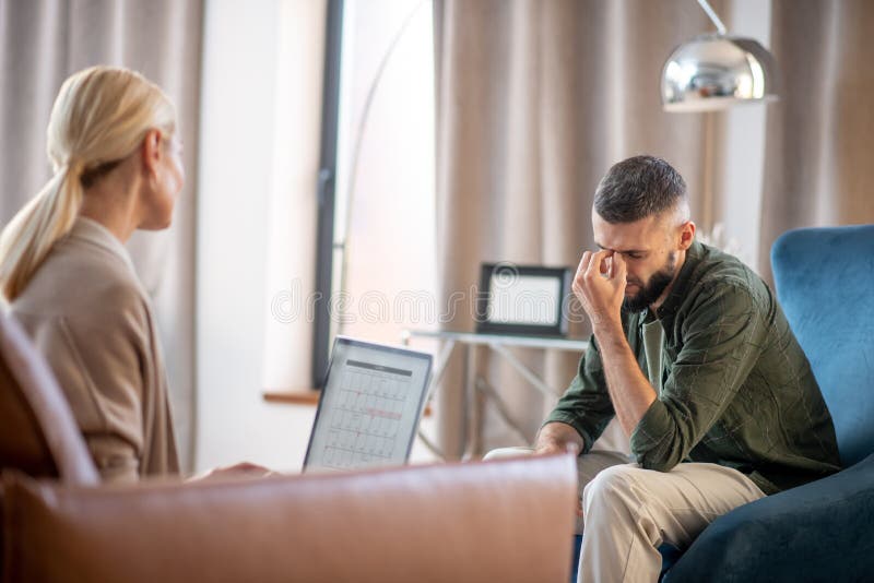 Dark-haired Man Feeling Concerned while Visiting Psychoanalyst Stock ...